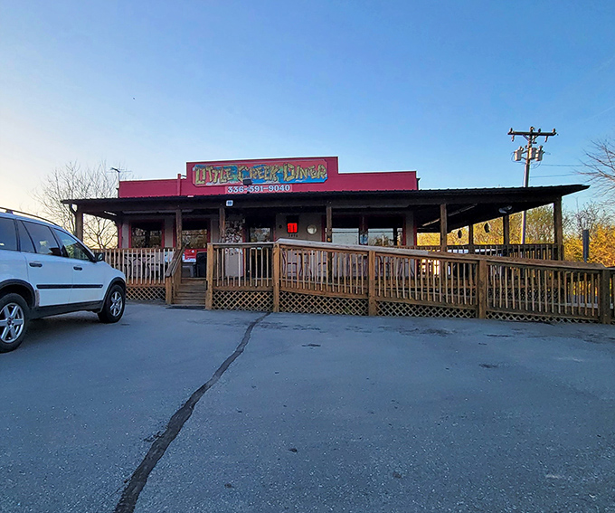The little red diner that could! Little Creek's welcoming wooden porch and bright exterior beckon hungry travelers like a culinary lighthouse in Germanton.