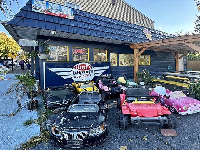 The blue exterior of Dad's Garage isn't just a restaurant—it's a time machine with kid-sized cars that'll make you wish you were eight again.