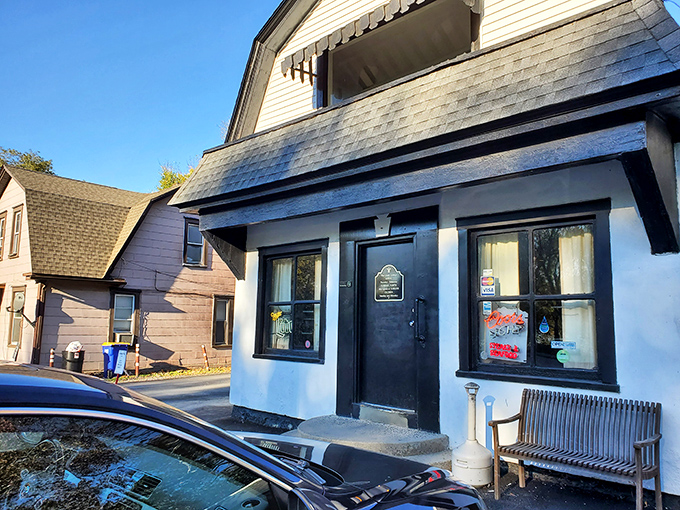 The unassuming exterior of Glass Lounge in Harrisburg hides culinary treasures within. Classic white building, modest signage—the perfect disguise for burger greatness.