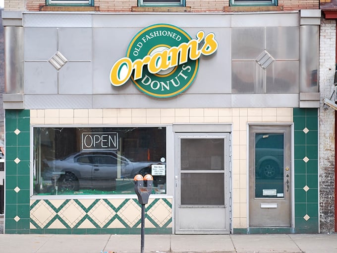 The green and cream facade of Oram's stands like a beacon of sweetness on Beaver Falls' main drag, promising old-fashioned delights within.