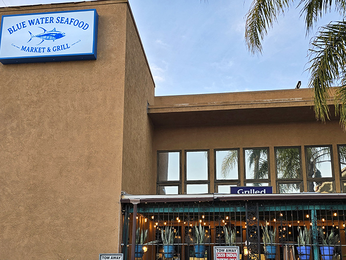 The unassuming exterior of Blue Water Seafood hides culinary treasures within. Like finding a pearl in an oyster, this modest storefront delivers oceanic delights beyond its simple façade.