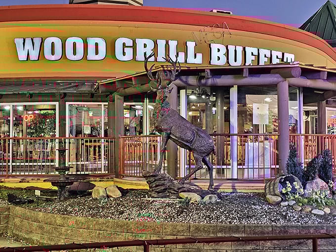 The majestic deer statue welcomes hungry travelers like a woodland ambassador saying, "Trust me, the food inside is worth the stop."