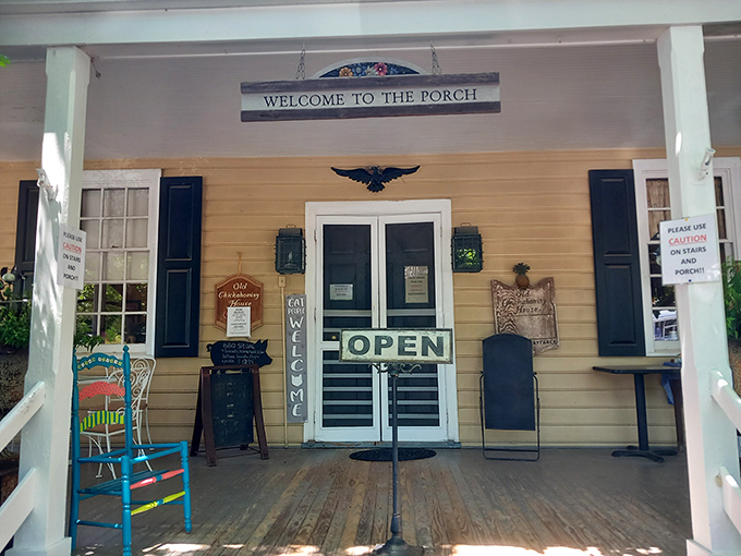 The welcoming porch at Old Chickahominy House feels like stepping into a Norman Rockwell painting where Southern hospitality isn't just promised—it's guaranteed.