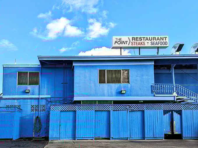 The distinctive blue exterior of The Point Restaurant stands like a beacon for hungry travelers—California's answer to a coastal lighthouse with seafood instead of warnings.