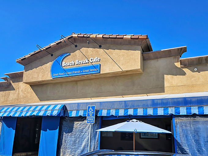 The blue-striped awnings and palm trees frame Beach Break Cafe like a postcard from coastal paradise. California breakfast dreams are made of this.