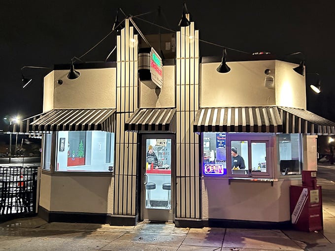 The iconic white building with bold red "POWERS HAMBURGERS" lettering stands like a time capsule in downtown Fort Wayne, beckoning burger lovers since 1940.