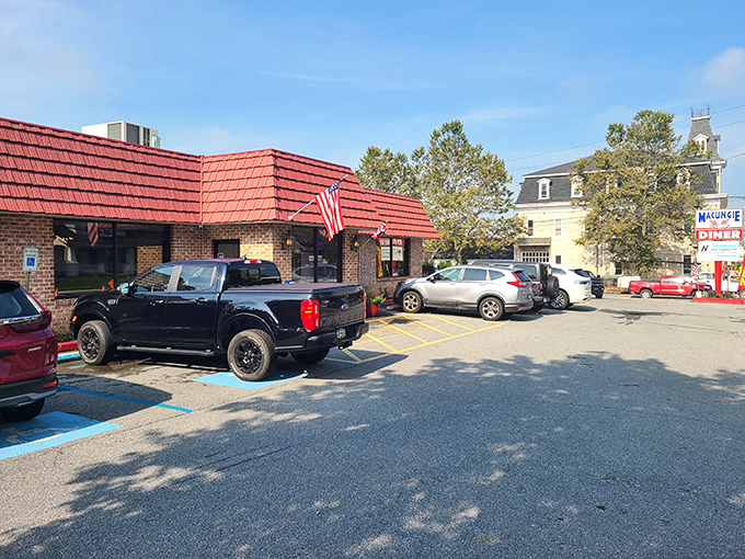 The iconic red-roofed brick building with American flags proudly waving says everything you need to know—comfort food and patriotism served in equal measure.