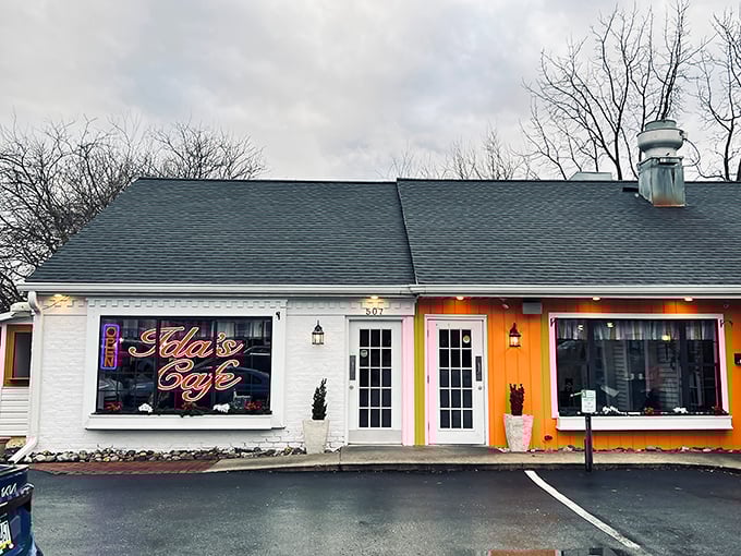 The bright orange accent on Ida's Café exterior isn't just eye-catching—it's like a beacon calling all hungry travelers home to Lancaster.