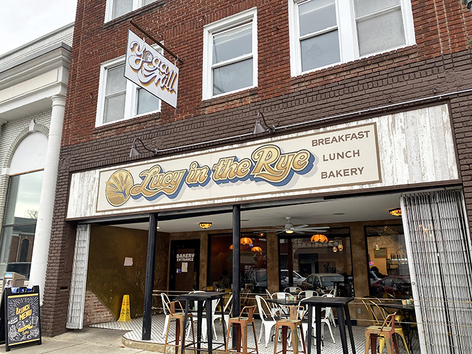 The storefront beckons like an old friend on Sylva's Main Street, with its cheerful blue and gold signage promising comfort and community inside.