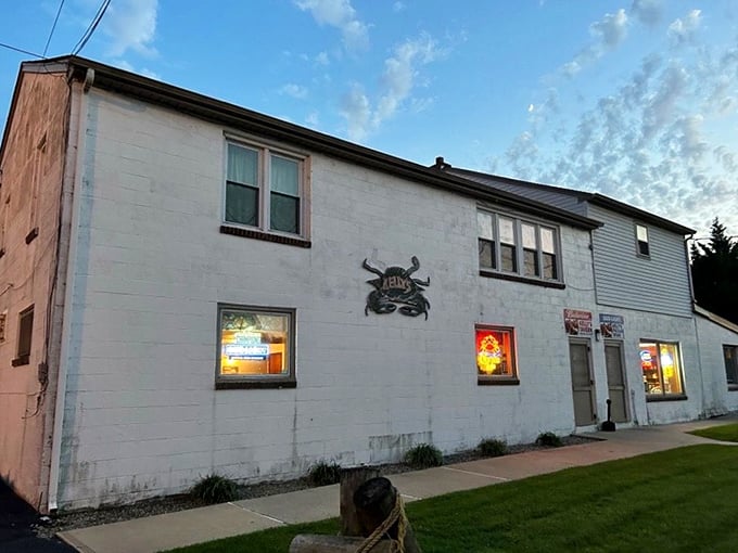 The unassuming exterior of Kelly's Tavern stands like a seafood speakeasy in Port Penn—proof that culinary treasures often hide in plain sight.