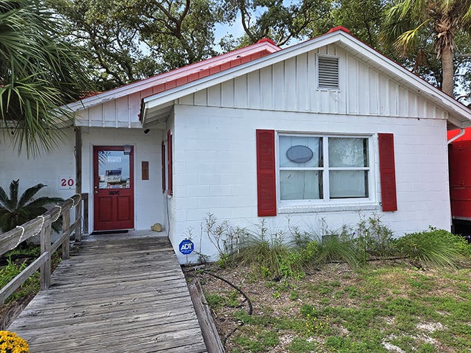 The little white house with the red roof isn't trying to impress anyone—until you taste what's cooking inside. Florida's hidden seafood treasures are often the most unassuming.