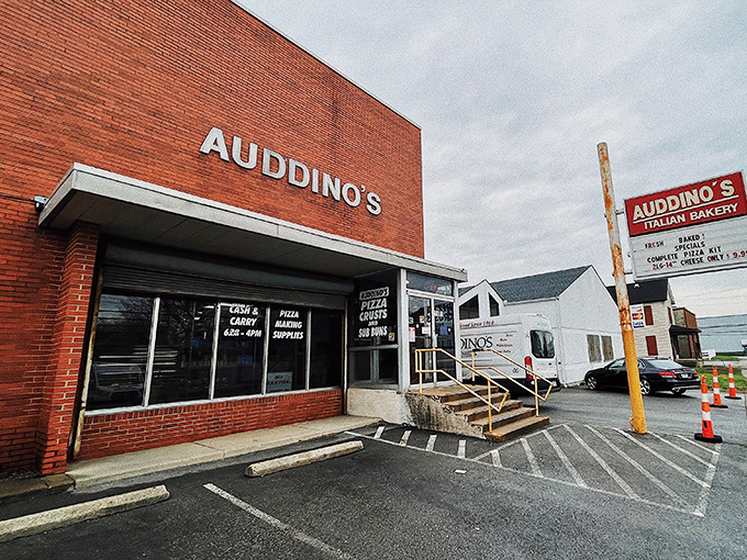 The iconic red sign of Auddino's Italian Bakery stands as a beacon of carb-laden hope on Clara Avenue. Early birds get the freshest bread!