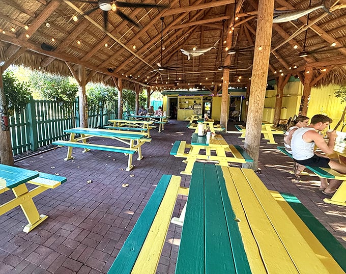 Beneath a breezy thatched roof, No Name Pub’s yellow-and-green picnic tables and twinkling string lights welcome you to the kind of island hideaway that’s worth every mile of the journey.