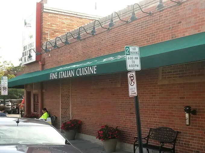 That iconic green awning at 95th and Lacrosse isn't just a landmark—it's a promise of Italian delights waiting inside. The flower planters add a homey touch.