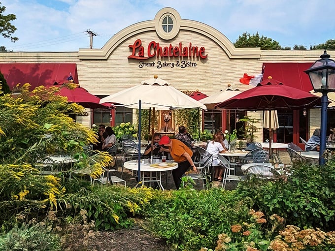 That iconic red signage against cream-colored stone isn't just curb appeal—it's a promise of Parisian delights hiding in plain sight in Columbus.
