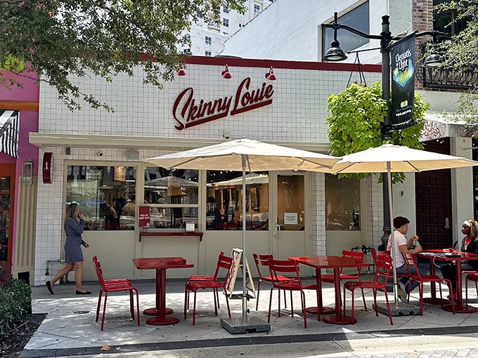 The white-tiled facade with that iconic red script logo is like Miami's version of the Bat-Signal for burger enthusiasts.