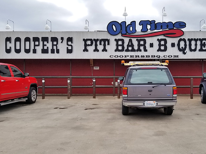 The unassuming red exterior of Cooper's might not scream "food paradise," but in Texas, the best barbecue joints often hide in plain sight.