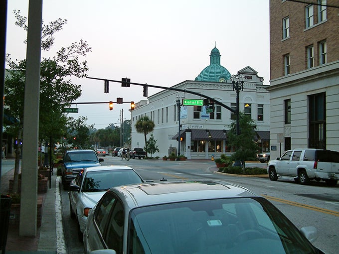 Downtown DeLand at dusk, where historic brick buildings and vintage lampposts create the perfect backdrop for an evening stroll. Small-town America at its finest.
