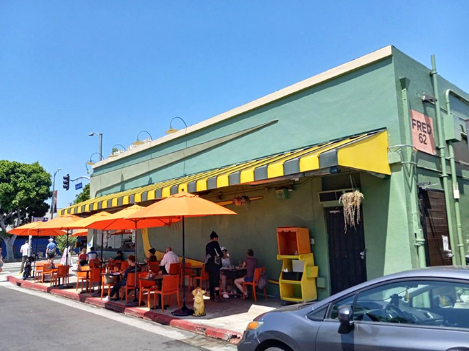 The mint-green exterior with orange awnings isn't just eye-catching—it's a beacon of hope for hungry souls wandering Vermont Avenue at any hour.
