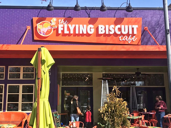 The purple building with its vibrant orange awning isn't just a restaurant—it's a morning beacon calling breakfast enthusiasts home.