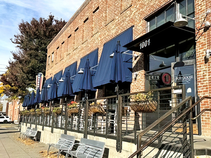 The brick façade and blue awnings of Fox & Goose stand like a British embassy on Sacramento's R Street, promising refuge for homesick Anglophiles and hungry locals alike.