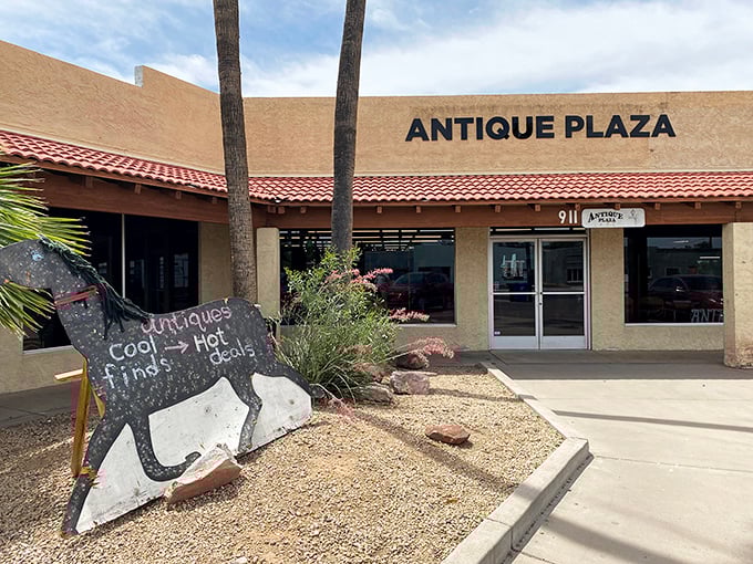 The unassuming exterior of Antique Plaza in Mesa hides a wonderland of vintage treasures. Like a time-travel portal disguised as a strip mall storefront!