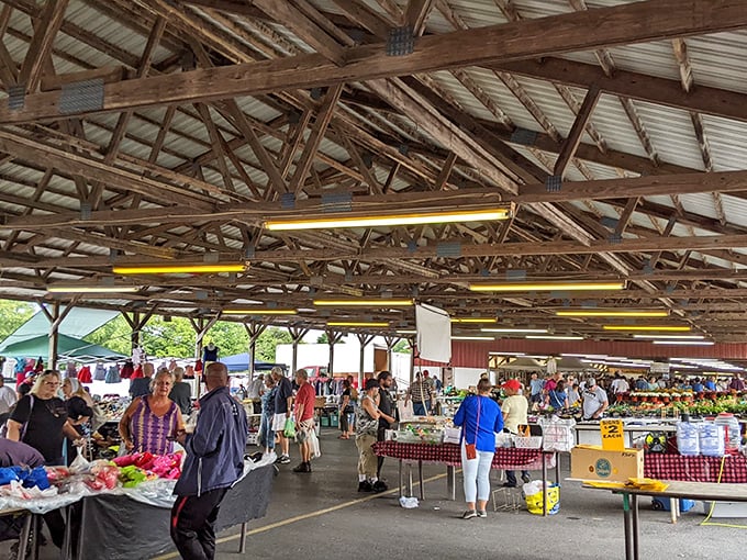 The wooden beams overhead create a cathedral-like atmosphere for this temple of fresh produce, where bananas are displayed with the care usually reserved for fine art.