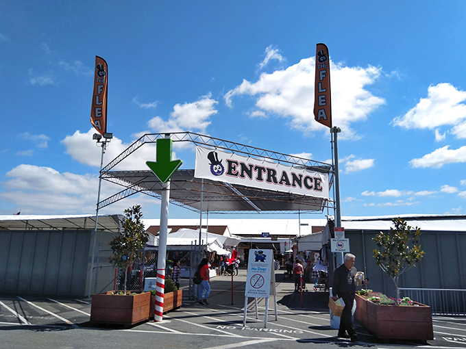 The covered walkways of the Farmers Market stretch toward the horizon like an endless bazaar, sheltering treasure hunters from the California sun.