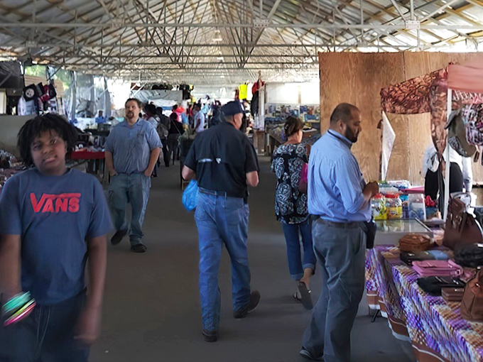 Treasure hunters navigate the covered walkways of Coastal Carolina Flea Market, where every aisle promises unexpected discoveries and memorable encounters.