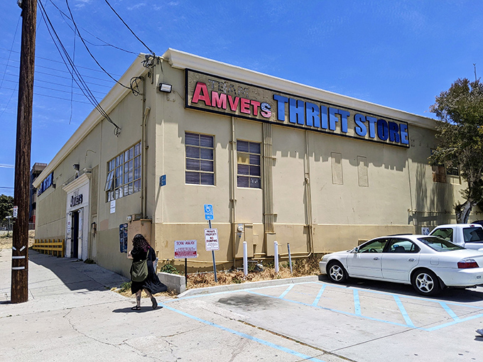 The unassuming exterior of Team Amvets Thrift Store in San Diego – where treasure hunting begins beneath that iconic red and blue signage.