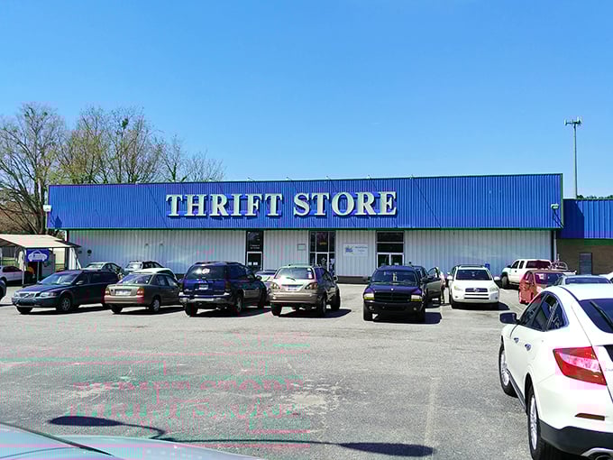 The iconic blue facade of Miracle Hill Thrift Store stands like a beacon of bargain possibilities on Wade Hampton Boulevard.