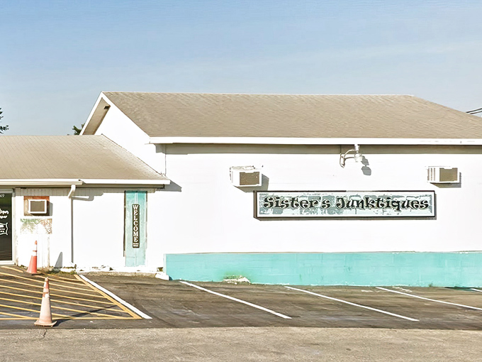 The unassuming exterior of Sisters Junktiques belies the wonderland within—like finding a portal to vintage paradise behind a modest storefront.