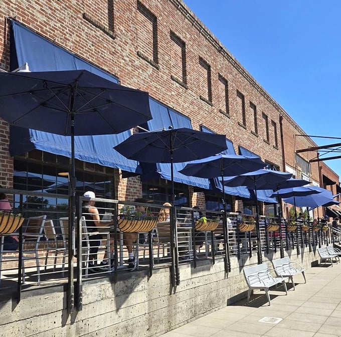 The brick façade and blue awnings of Fox & Goose stand like a British embassy on Sacramento's R Street, promising refuge for homesick Anglophiles and hungry locals alike.