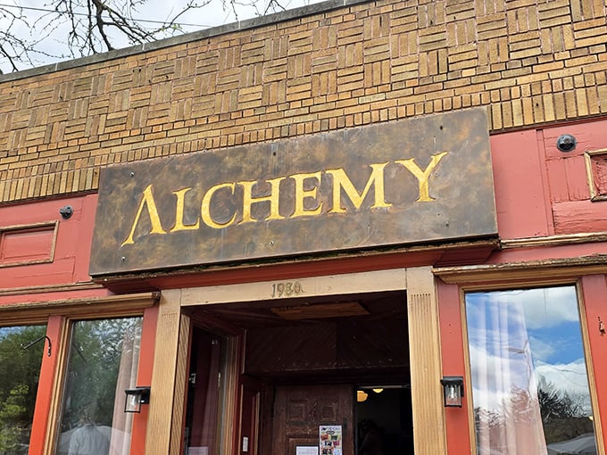 The weathered brick and vintage signage of Alchemy's exterior isn't just Instagram-worthy—it's a promise that something authentic awaits inside.