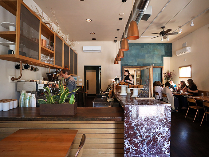 The unassuming exterior of Coquine belies the culinary magic happening inside. Like finding a Michelin-worthy meal in your neighbor's living room.