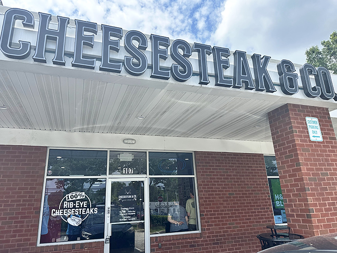 The unassuming storefront speaks volumes: "100% RIB-EYE CHEESESTEAKS" isn't just a promise—it's a delicious declaration of intent.