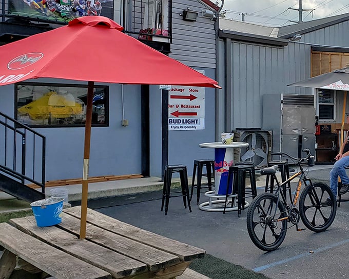 The bright red awning of Jeff's Taproom & Grille stands out like a culinary lighthouse, beckoning hungry travelers with promises of Delmarva's best burgers.