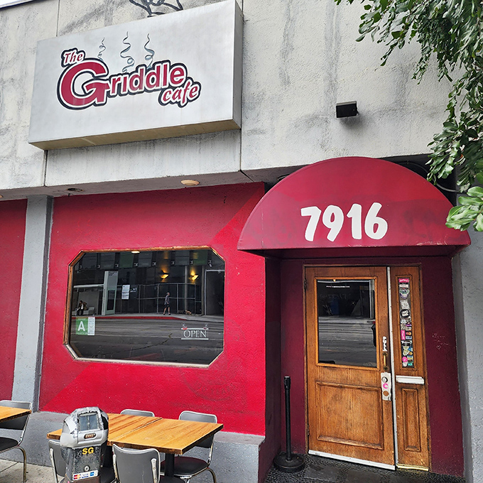 The bright red exterior of The Griddle Cafe beckons like a breakfast beacon on Sunset Boulevard, promising sweet salvation for hungry souls.