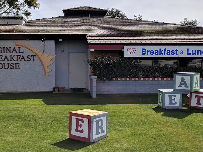 Those playful alphabet blocks aren't just lawn ornaments – they're your first hint that breakfast magic awaits inside.