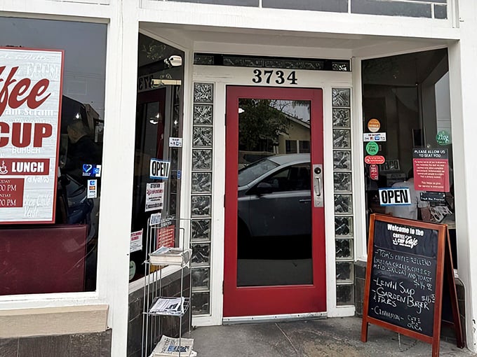 The unassuming exterior hides breakfast greatness like a superhero's secret identity. Blue trim, large windows, and a vintage sign promising morning salvation.