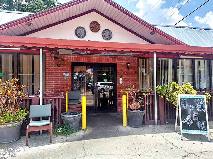 The pink-trimmed roof and three decorative coins above the entrance aren't just charming—they're a promise of the comfort food treasures waiting inside.