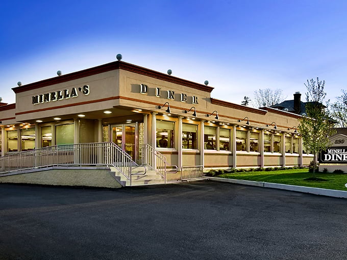 The classic pink exterior of Minella's Diner stands like a time capsule on Lancaster Avenue, promising comfort food and conversations that matter.