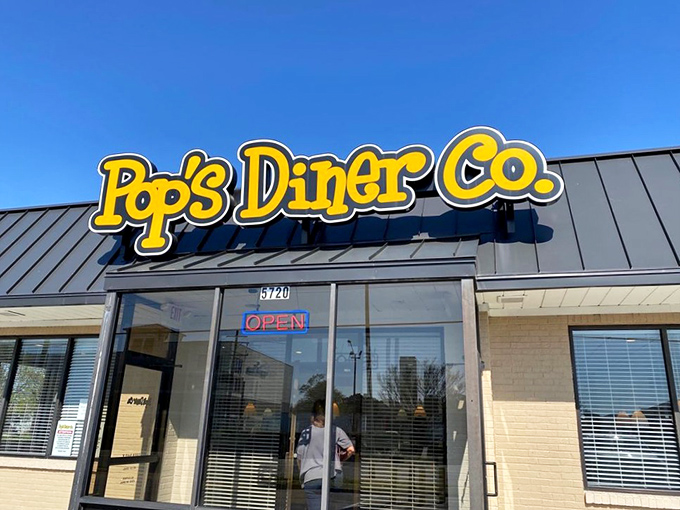 The bright yellow Pop's Diner Co. sign promises breakfast salvation to hungry travelers on Northampton Boulevard. Morning magic awaits!