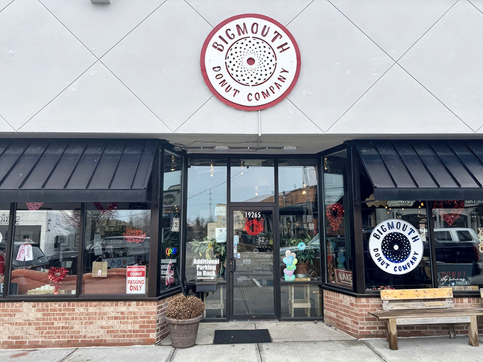 The unassuming storefront of Bigmouth Donut Company beckons with its clean white facade and distinctive circular logo—proof that donut paradise often hides in plain sight.