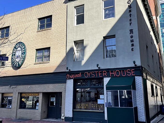 That iconic red neon sign beckons like an old friend, promising seafood treasures within these historic brick walls of Pittsburgh's Market Square.