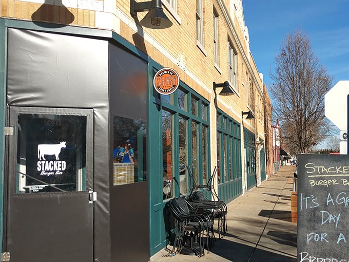 The historic brick façade of Stacked STL stands proudly against the St. Louis sky, promising burger nirvana within those unassuming walls.