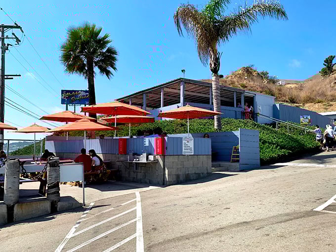 The unassuming white building with its cheerful lobster sign promises seafood nirvana. No fancy frills needed when the ocean is your backdrop.