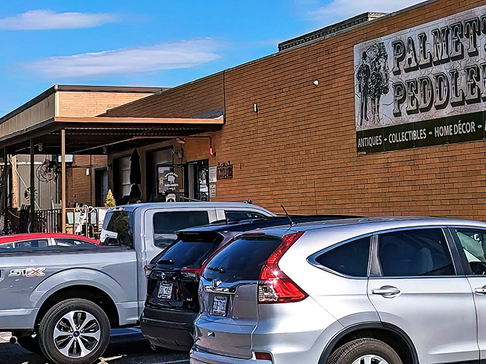 The unassuming brick exterior of Palmetto Peddlers hides a universe of treasures within, like a TARDIS of trinkets waiting for curious explorers.