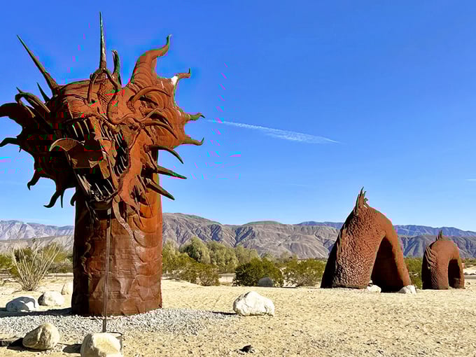 The fearsome dragon of Galleta Meadows emerges from the desert floor, its metal scales glinting under the California sun like nature's own special effect.