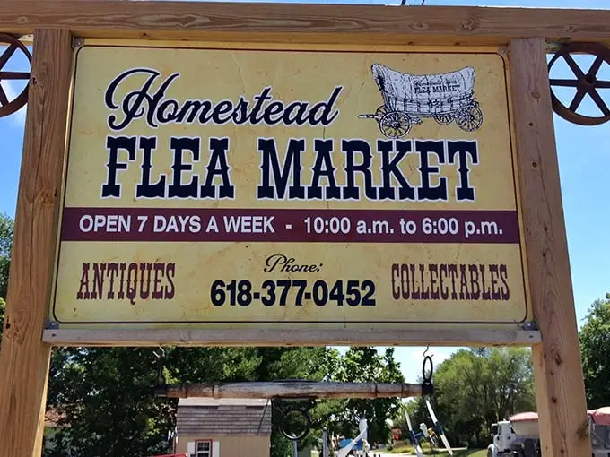 The weathered tin roof and rustic "FLEA MARKET" sign aren't just decoration—they're a promise of treasure hunting adventures waiting inside.